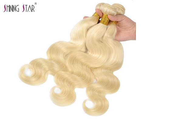Paquetes rubios 100% de la onda del cuerpo del cabello humano 613 con el frontal ningún enredo ningún vertimiento