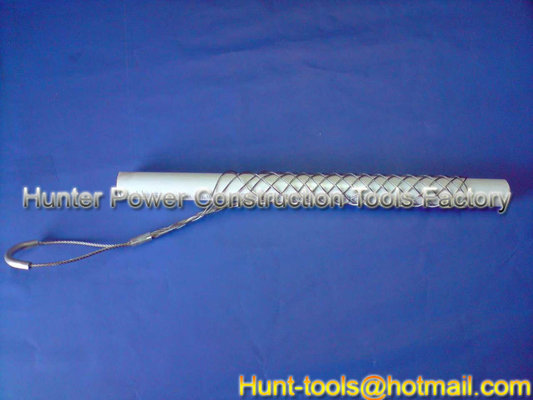 Hanger grip for electrical cable as it hangs in vertical, sloping