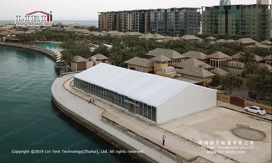 alluminum frame clear span tent with glass sidewalls and sandwich panel
