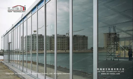 alluminum frame clear span tent with glass sidewalls and sandwich panel