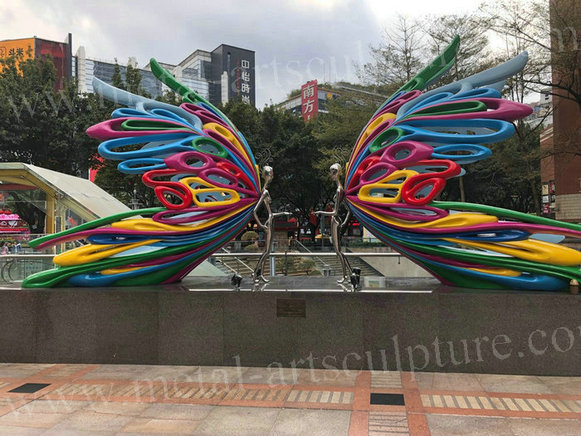 Human Body With Wings Metal Art Sculpture Painted Color As City Landmark