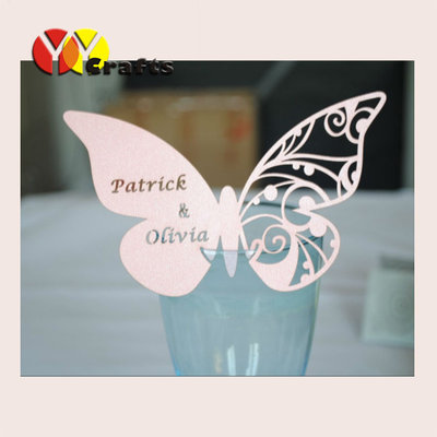 Paper butterfly wine glass place cards pink and light blue color for baptism ceremony